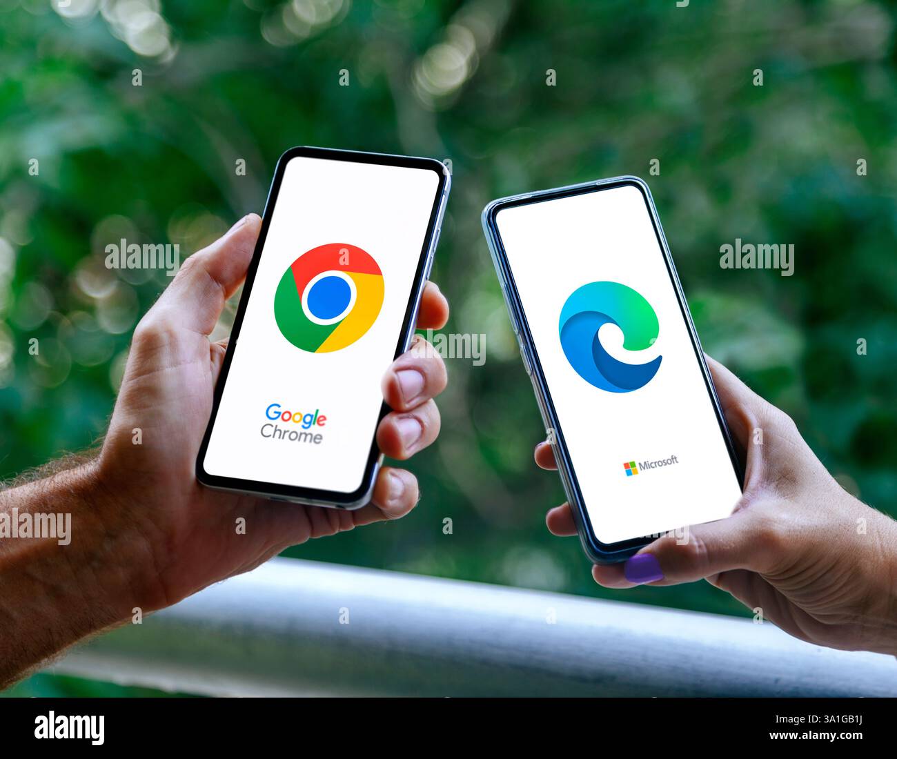 Hands of two people with mobile phones showing the chrome browser on ...