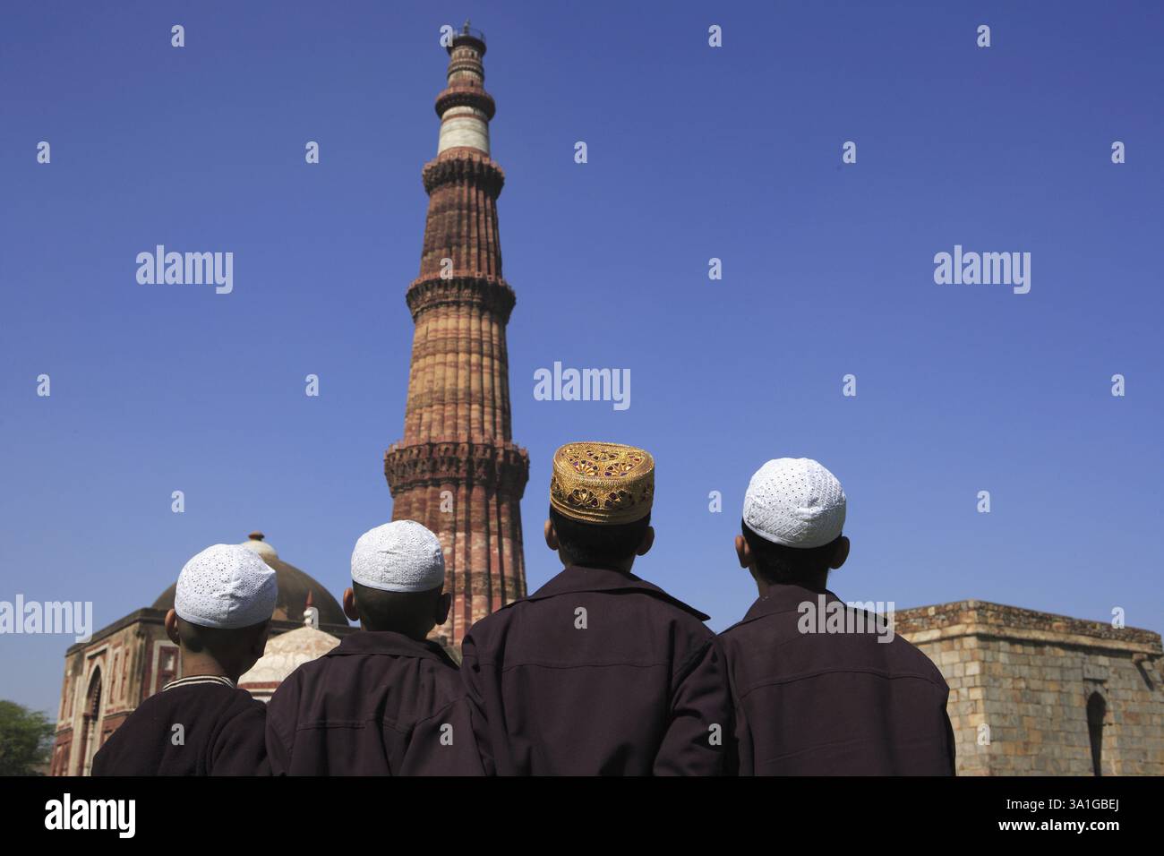 Children doing religious prayer Namaz in front of Qutab Minar built in ...