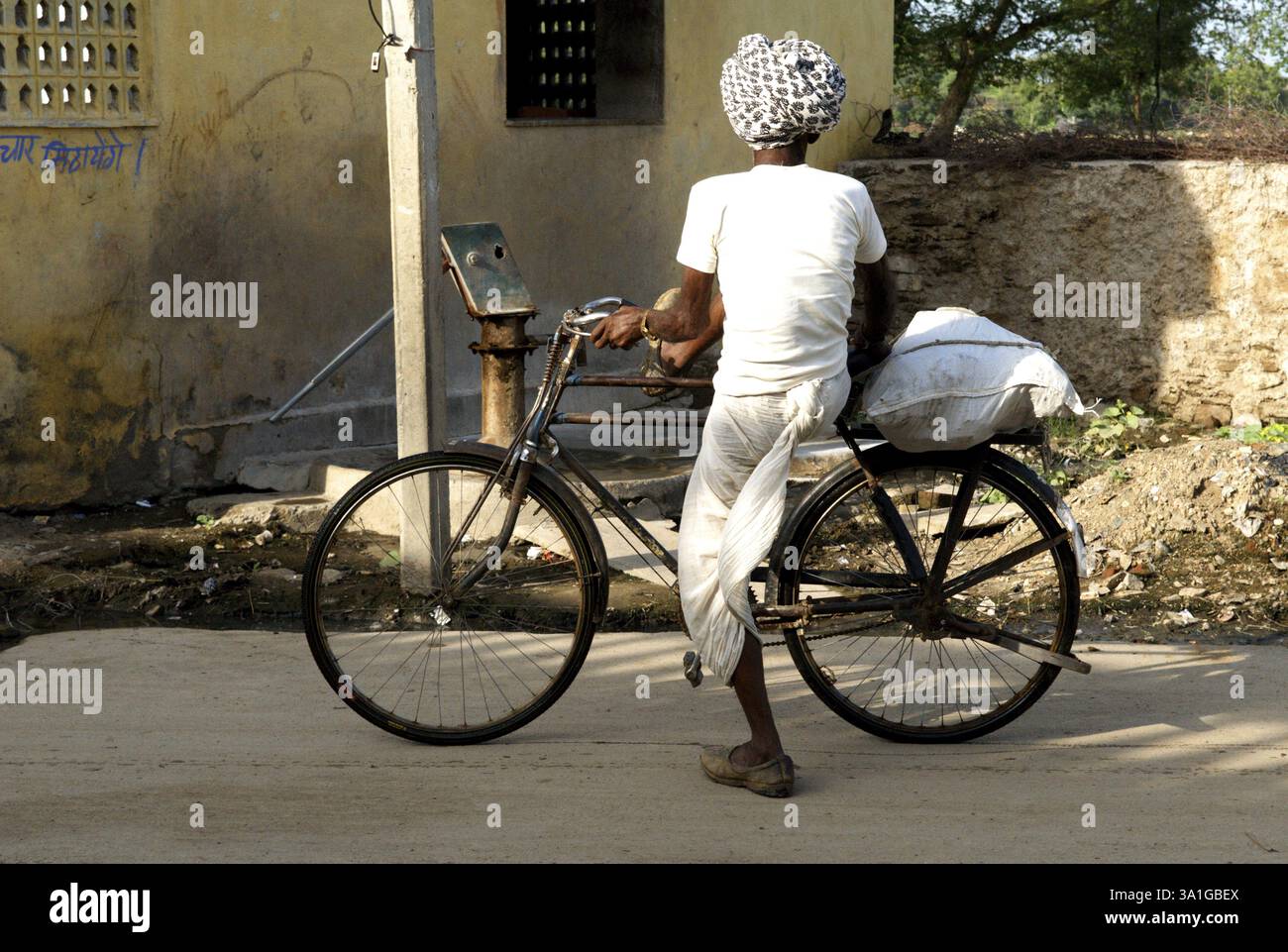 Farmer riding cycle, Dilwara, Rajasthan, India, Asia Stock Photo - Alamy