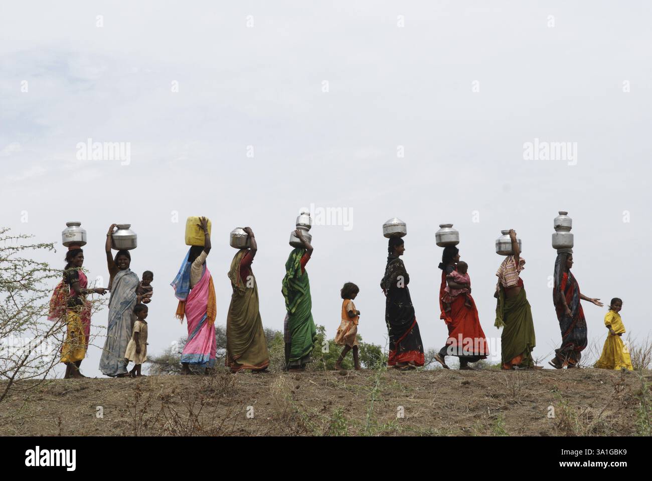 Rural women carrying water pots, water scarcity and migration in ...