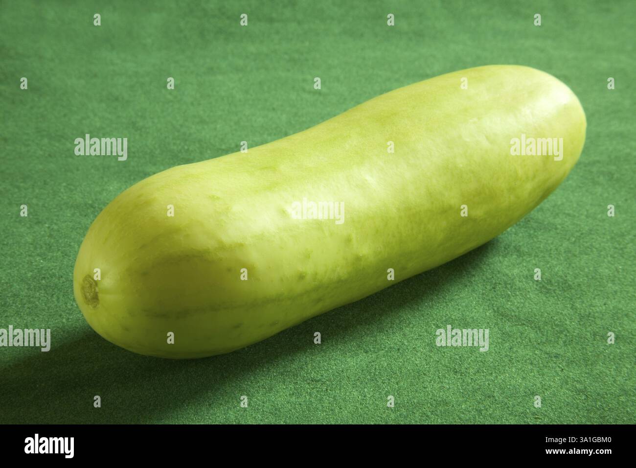 Green vegetable, Cucumber Kakdi on green background Stock Photo - Alamy