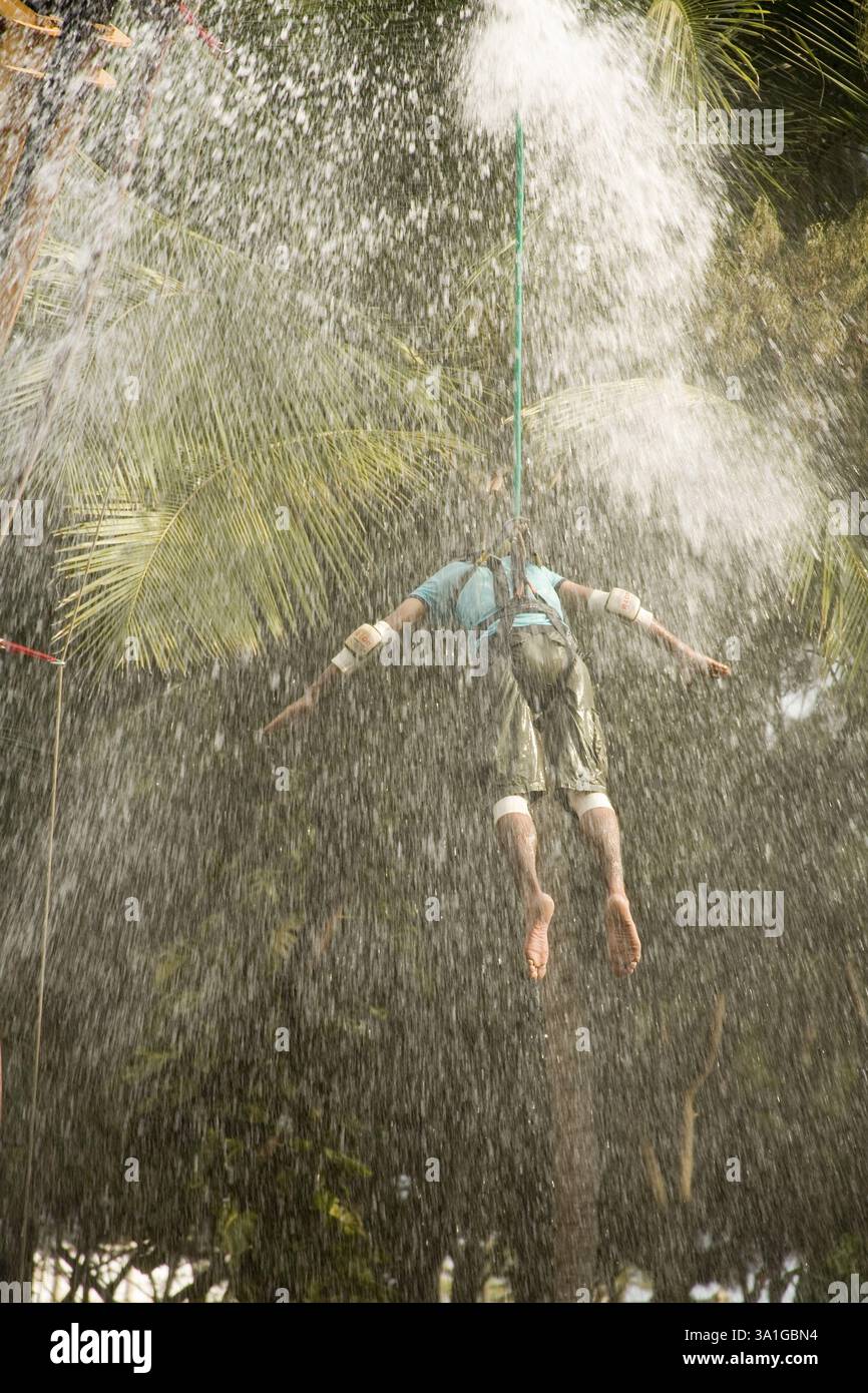Adventure game, man hanging with water pipe, India, Asia Stock Photo ...