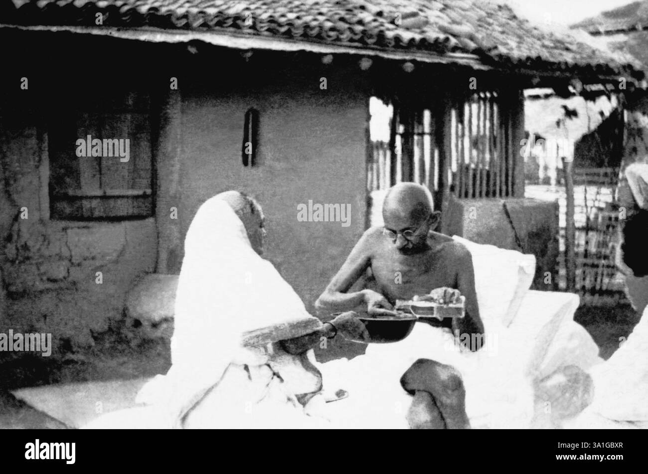 Kasturba Gandhi and Mahatma Gandhi washing his hands and mouth after ...