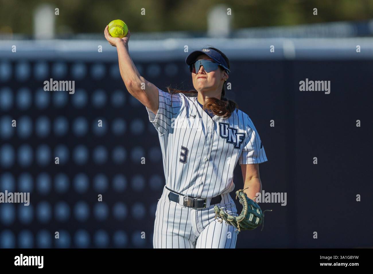 North Florida outfielder Chloe Culp (3) warms up before an NCAA ...
