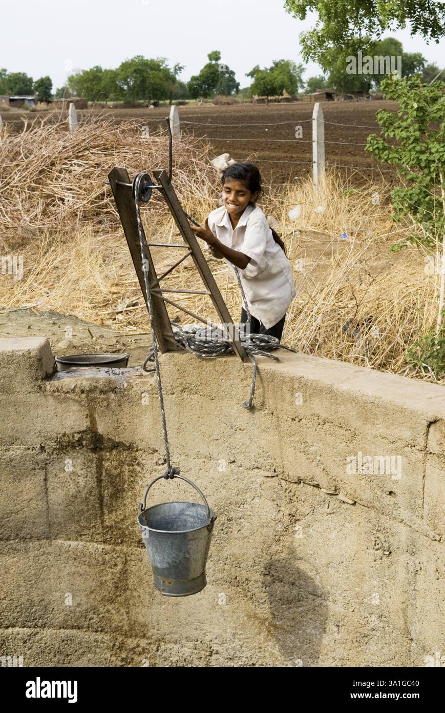 Girl fetching water from well, Marathwada, Maharashtra, India, Asia ...