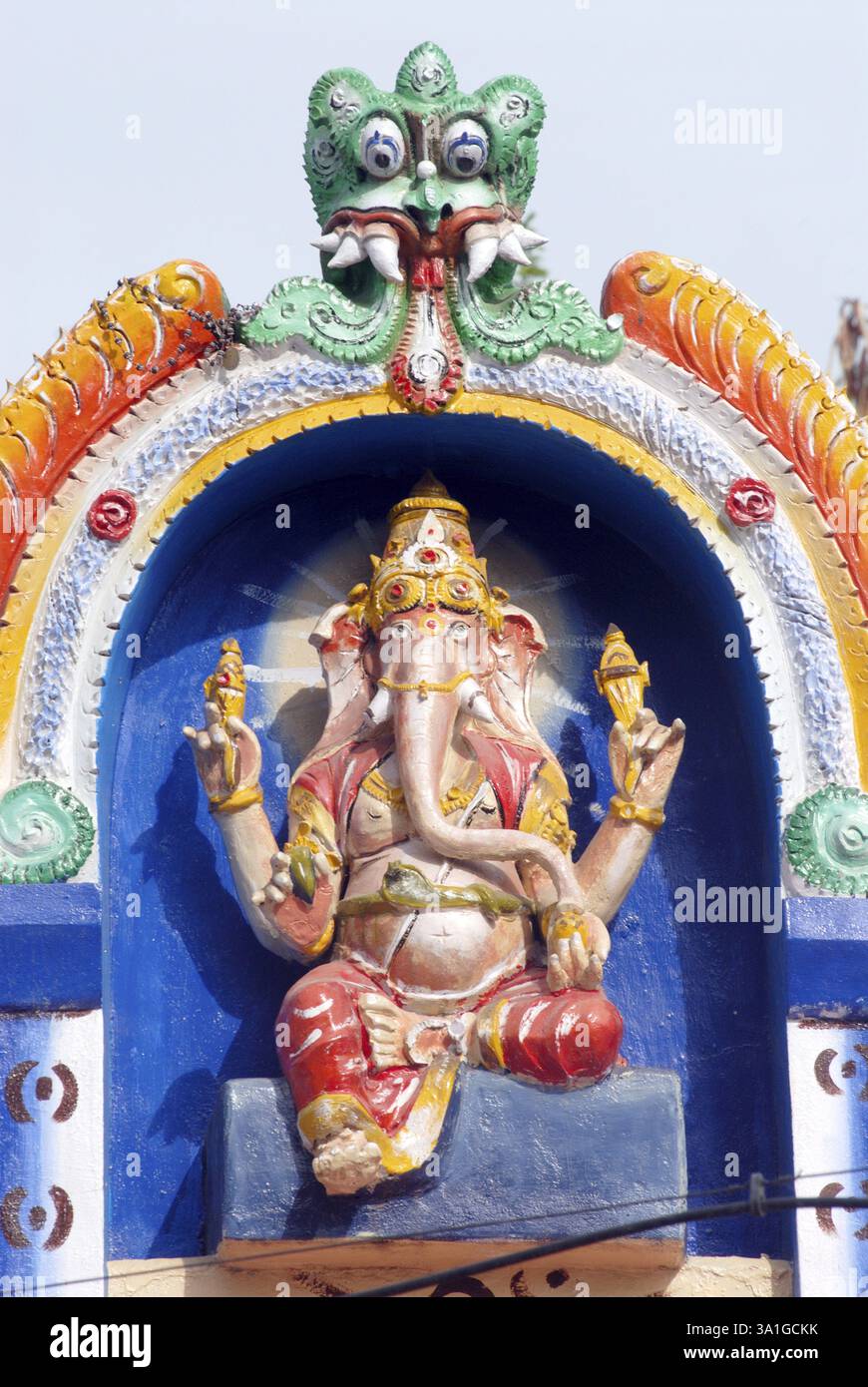 Colourfully painted sculpture of lord Ganesh in the temple at ...