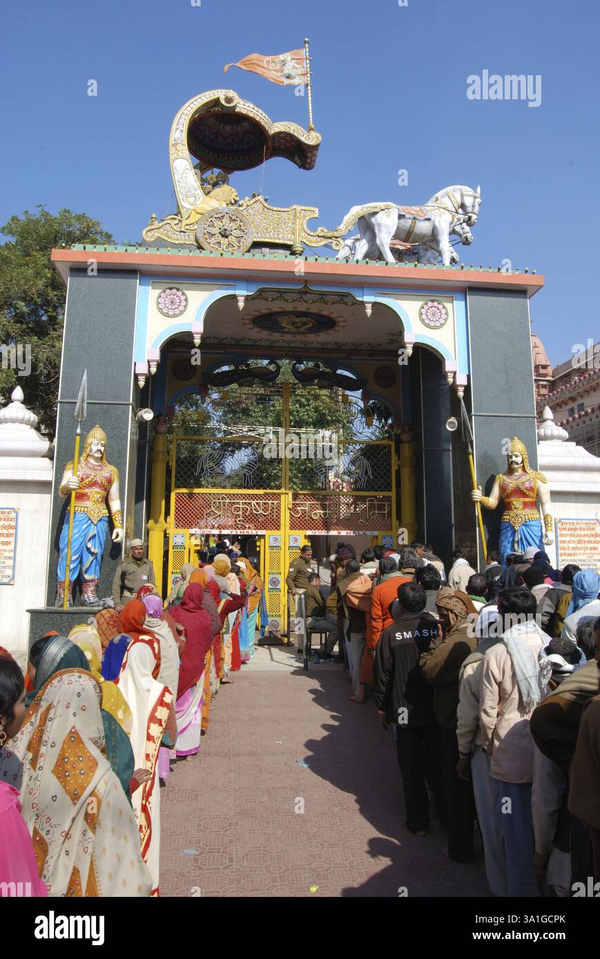 Queue of men and women at main gate of Krishna janmbhumi temple ...