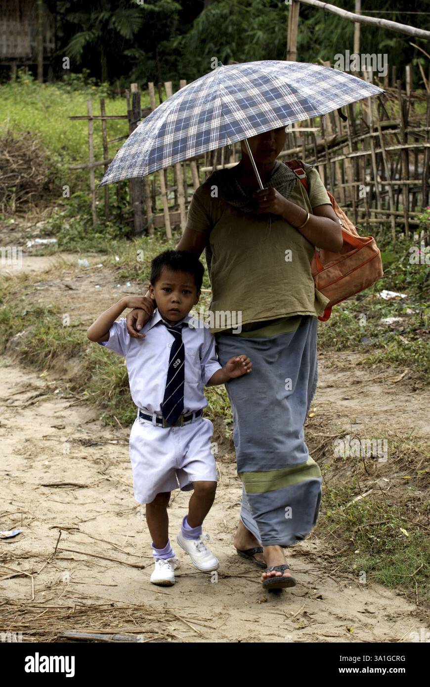 Father accompanying son to school, Diyun, Arunachal Pradesh, India ...