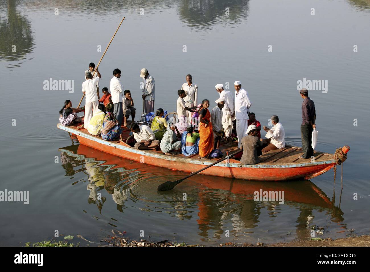 Villagers of the Haripur village loading their bicycles on a boat ...