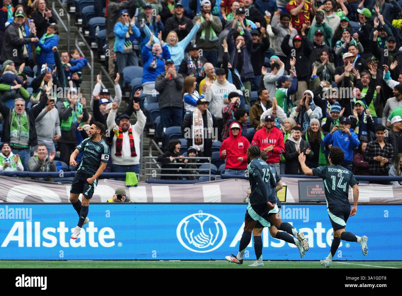 Seattle Sounders midfielder Cristian Roldan, left, celebrates scoring ...