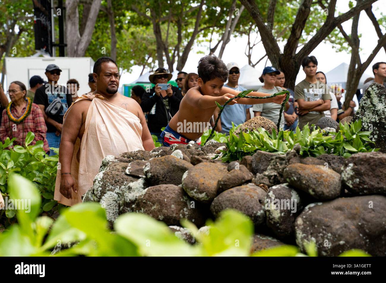 A ti leaves lei is offered during Hokulea's 50th birthday commemoration ...
