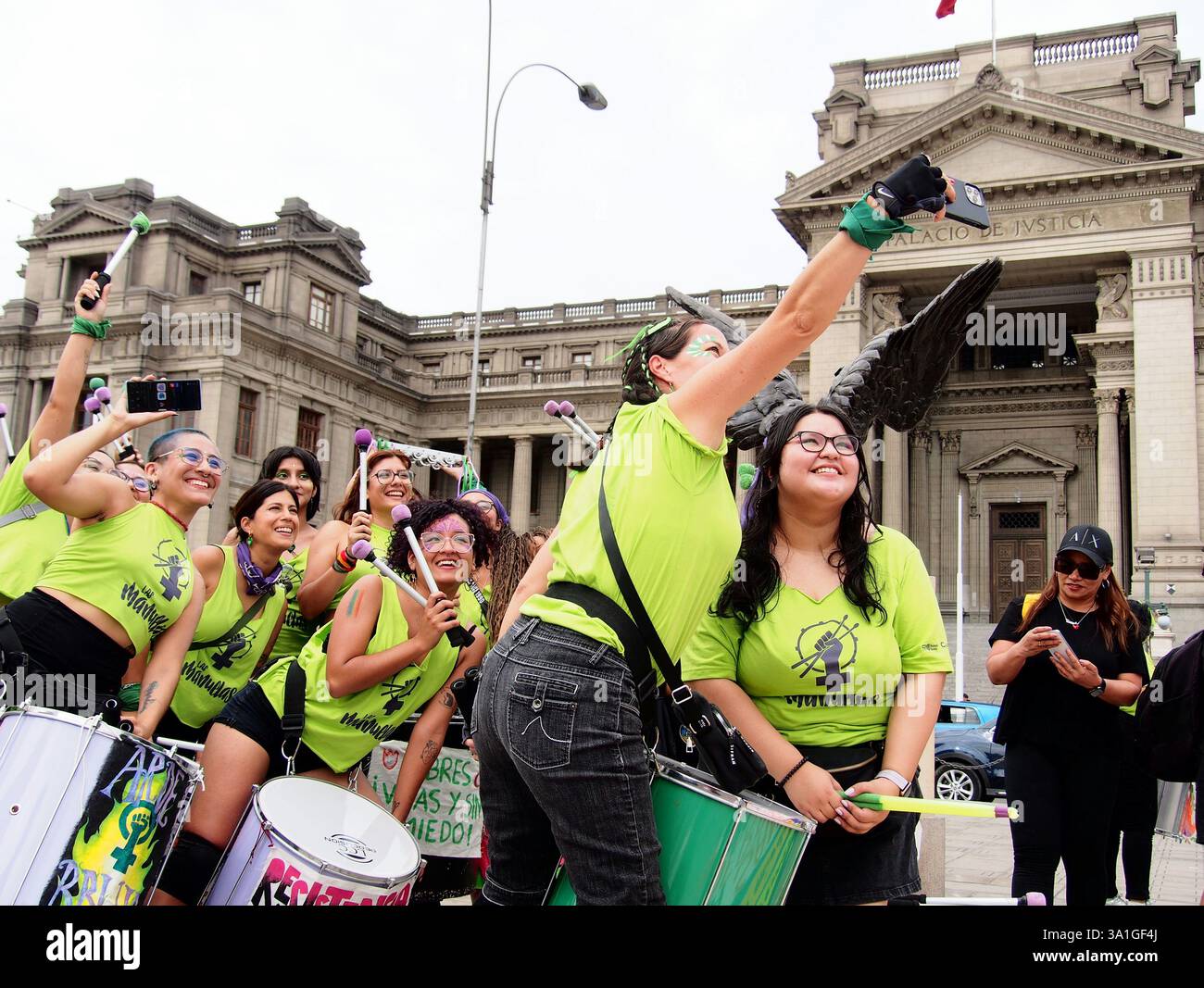 Female protesters taking a selfie in front of the Lima courthouse when ...
