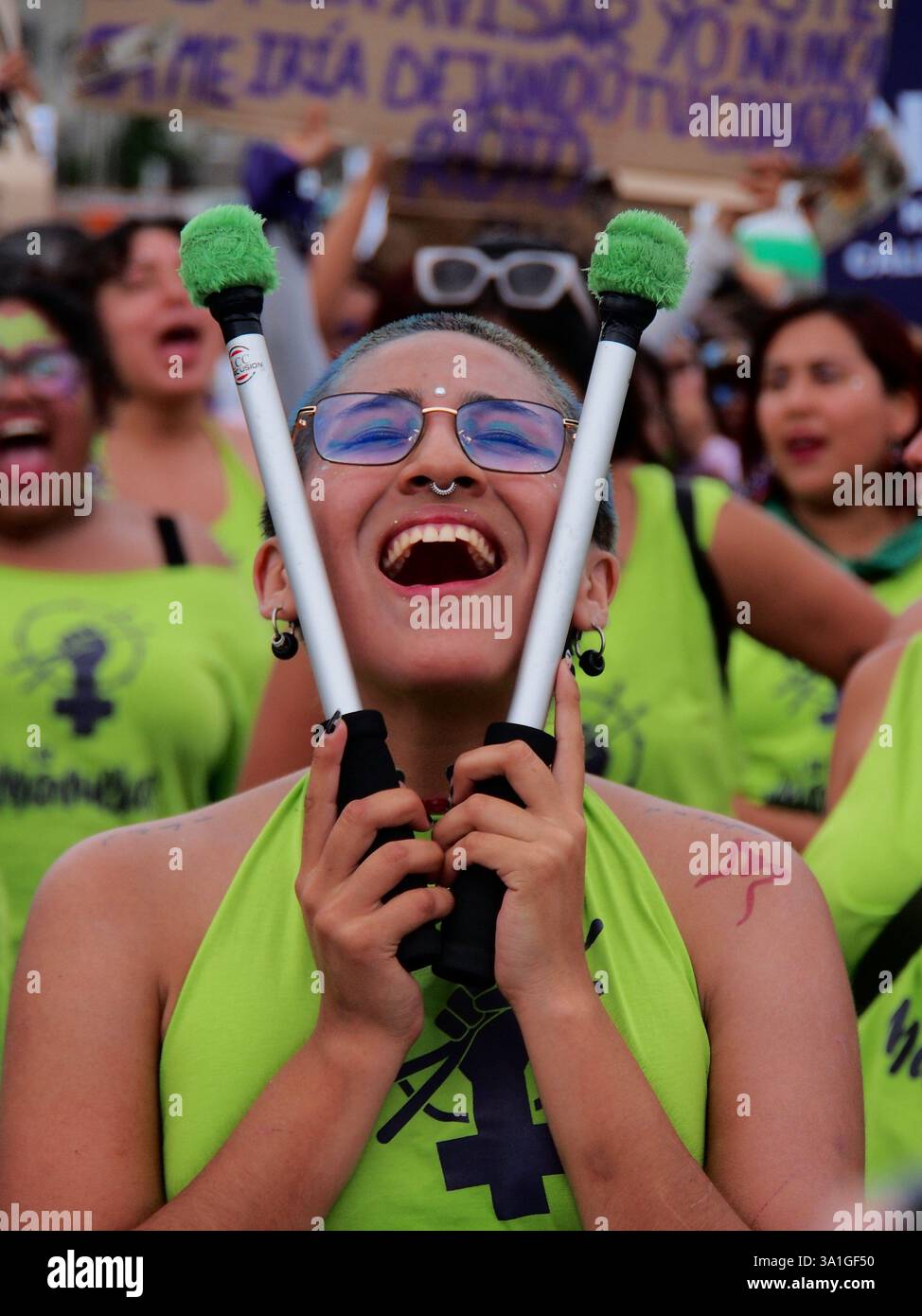 Lima, Peru. 08th Mar, 2025. A woman screaming with drumsticks when thousands of women took to ...