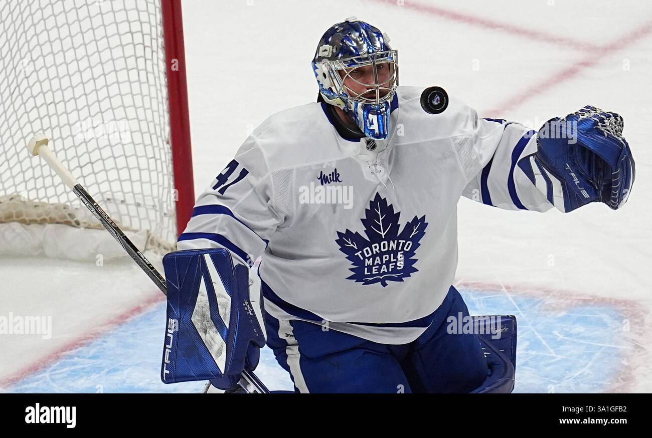 Toronto Maple Leafs goaltender Anthony Stolarz looks to stop a shot in ...
