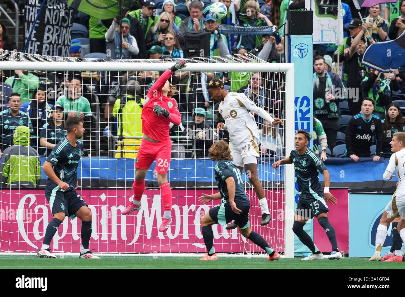 Seattle Sounders goalkeeper Andrew Thomas punches the ball away from ...