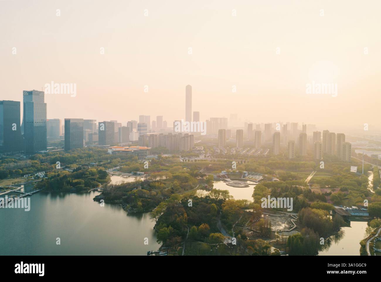 Air pollution envelops modern city skyline during sunset with visible ...