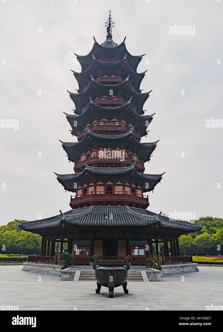 A multi-tiered pagoda rises majestically with intricate wooden ...