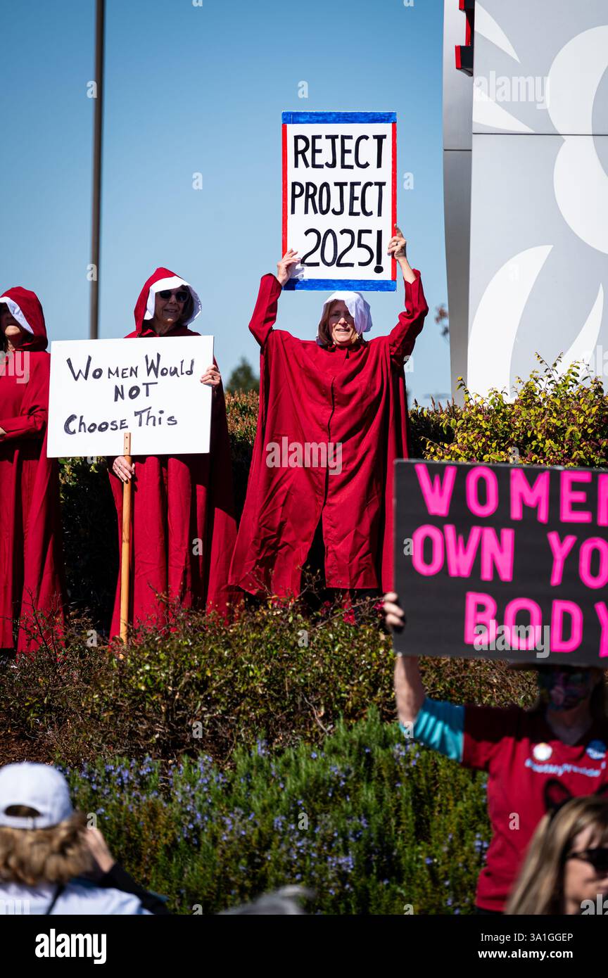 Roseville, CA U.S.A. - Mar. 8, 2025: A protester in a red Handmaid's ...