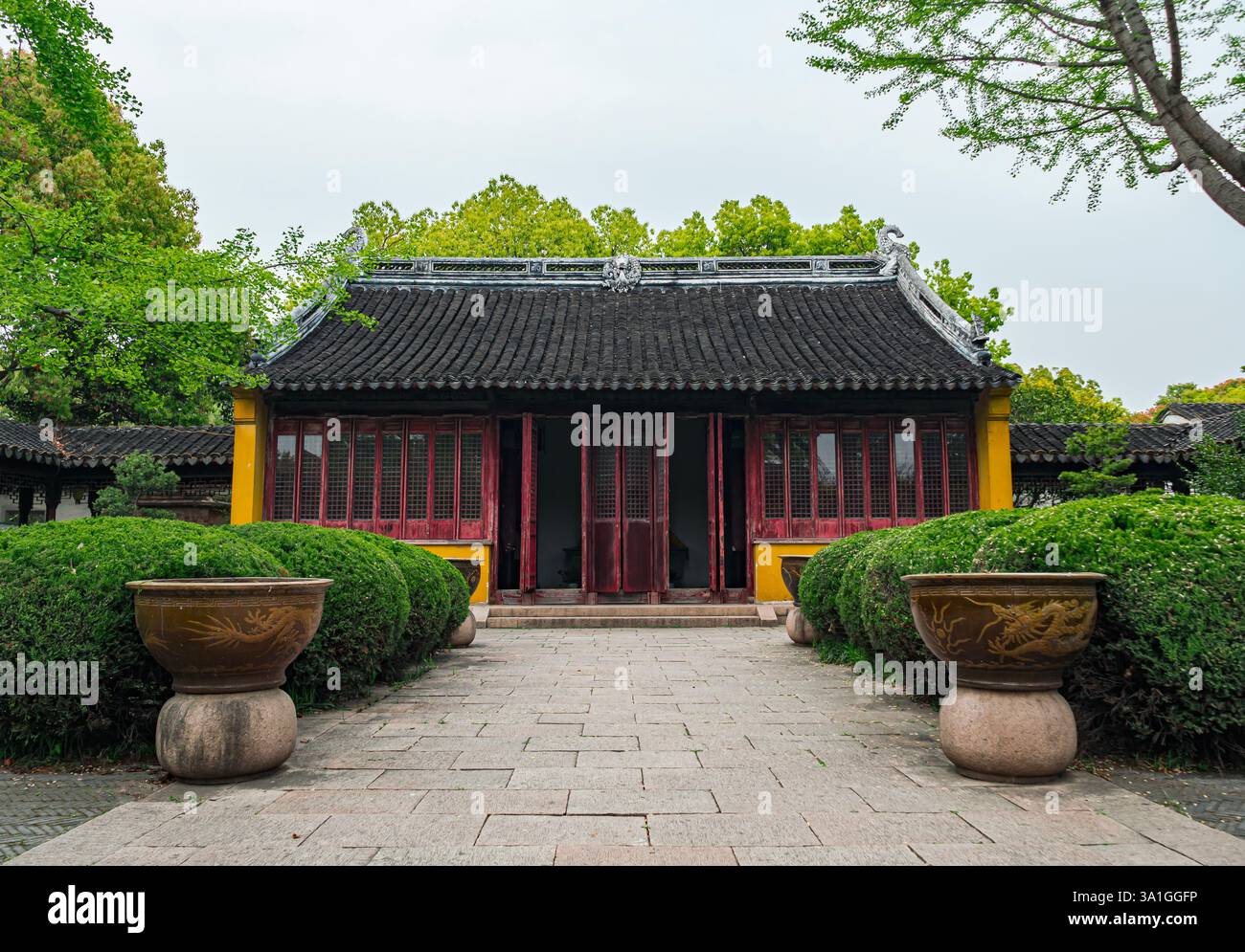 Traditional Chinese architecture with vibrant colors and lush greenery ...