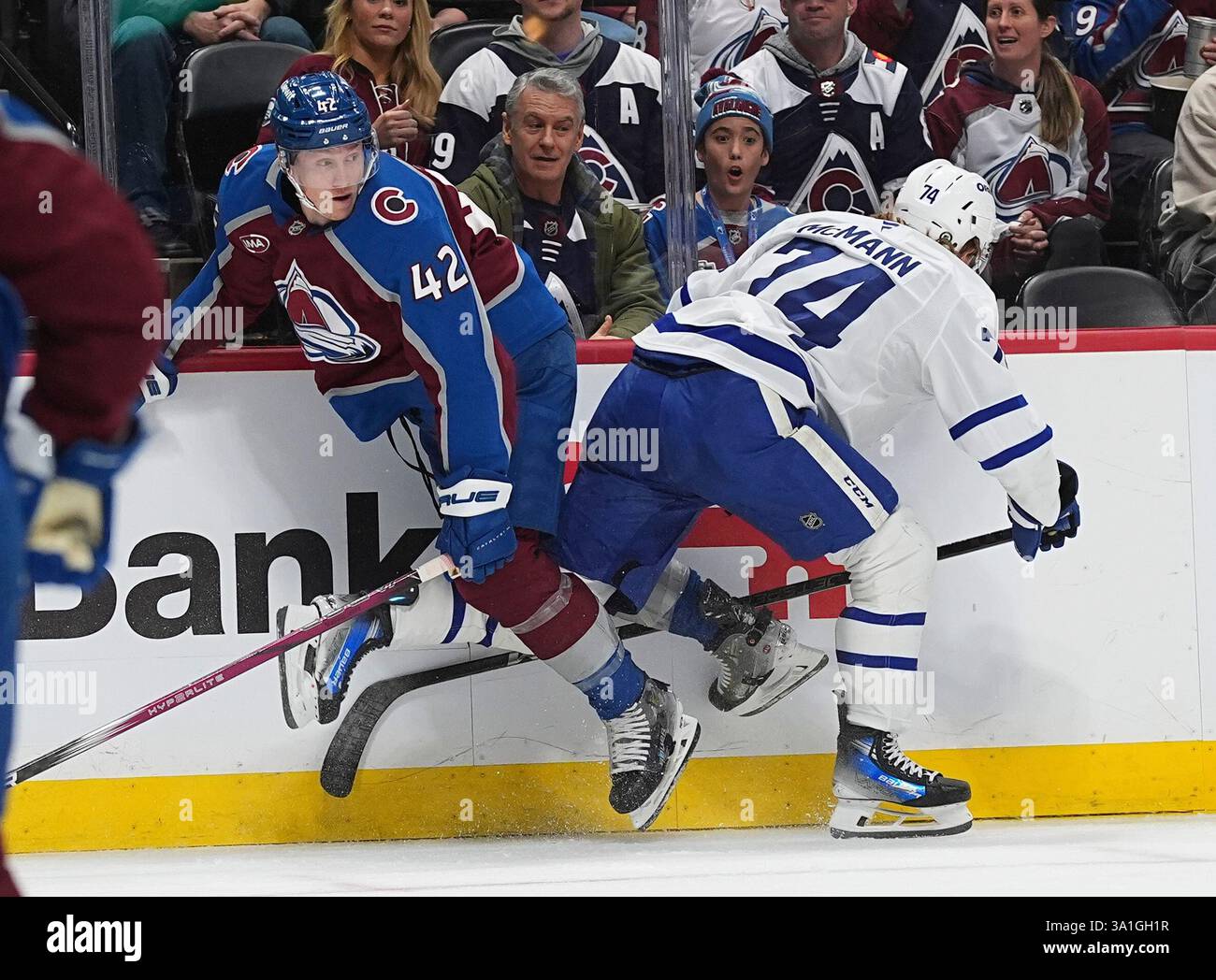 Colorado Avalanche defenseman Josh Manson, left, gets tangled up with ...
