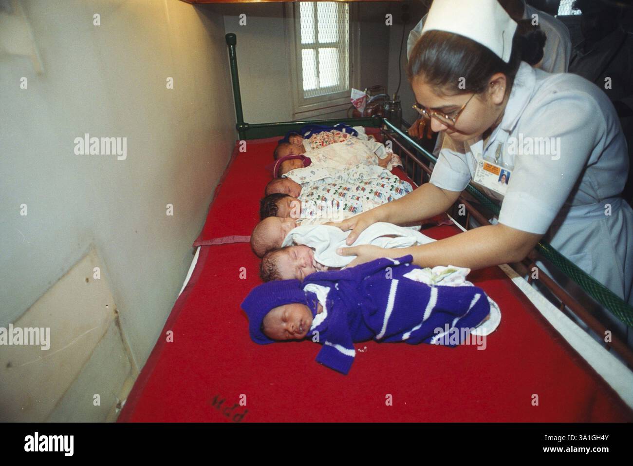 Nurse with millennium babies born on 01-01-2000 NO MR Stock Photo - Alamy