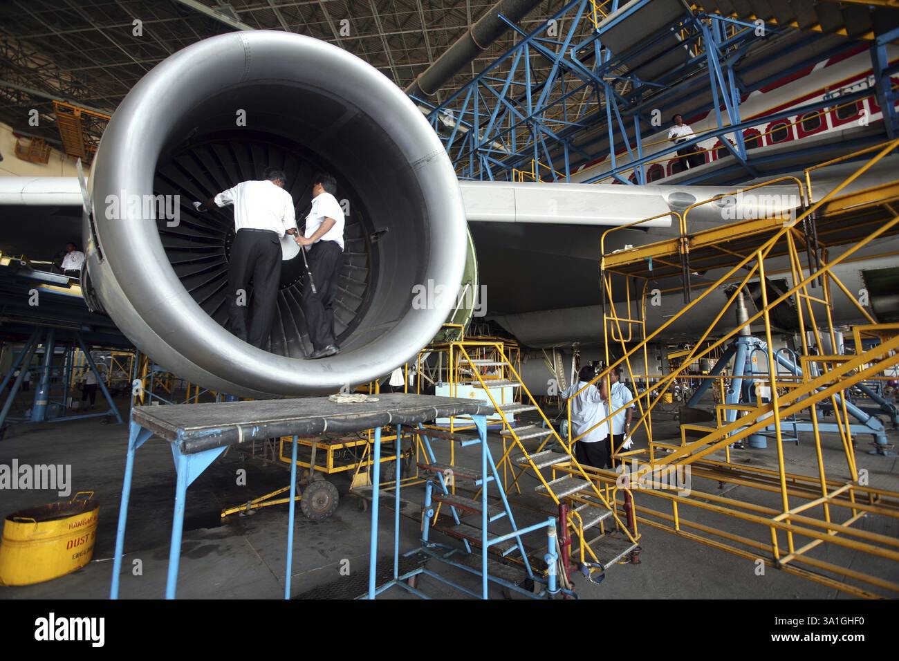 Engineers working on Boeing 747-400 parked for maintenance & repair at ...