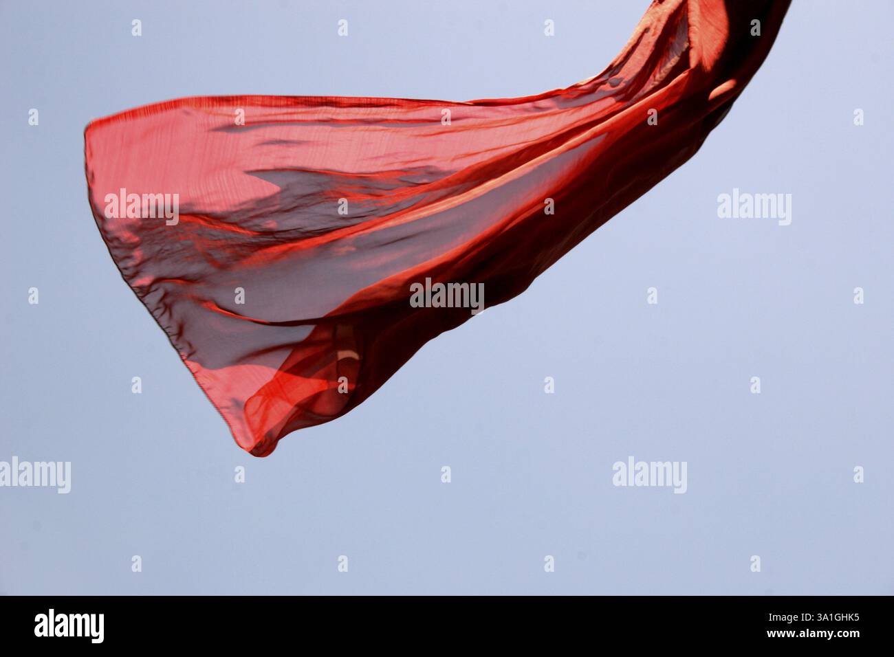 Abstract of Indian traditional ladies wear known as saree of red color ...