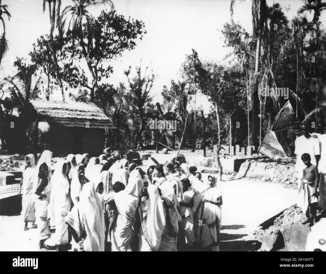 A group of crying women waiting to meet Mahatma Gandhi after the riots ...