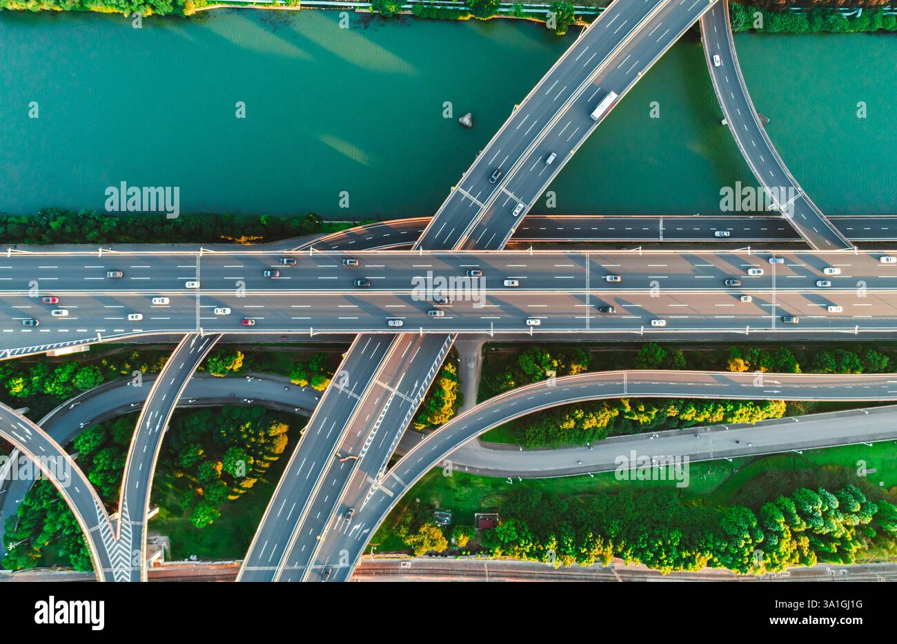 Aerial of vehicles navigate a complex highway system, showcasing ...