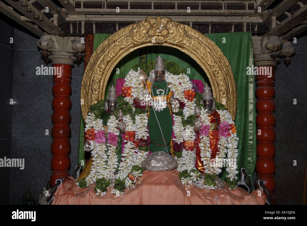 Decorated Urchava deity of lord Subrahmanya with consorts Valli and ...