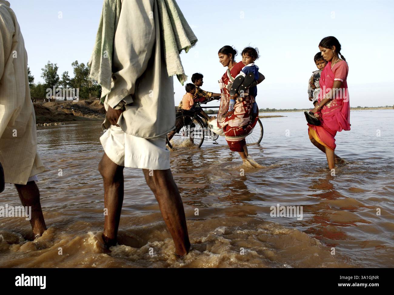 People walking in shallow river water, Garwa and Latehar, Jharkhand ...