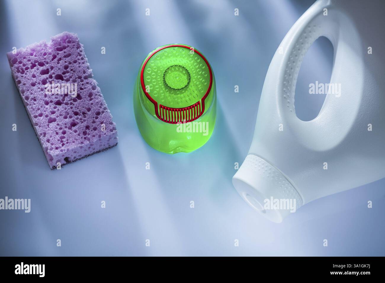 New bottles sponge on white surface Stock Photo - Alamy