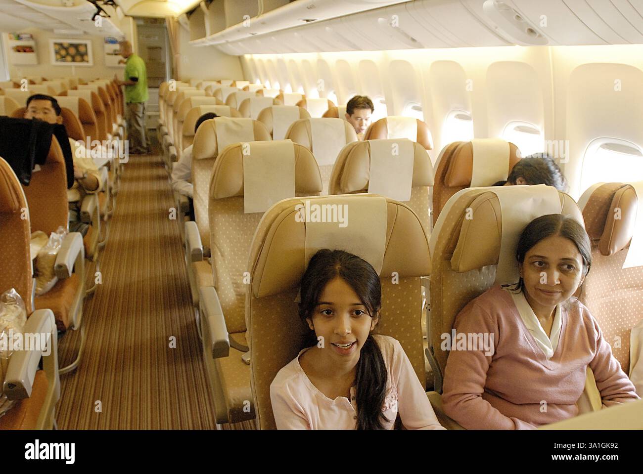 Passengers sitting in flight to Hong Kong from Singapore, Singapore ...