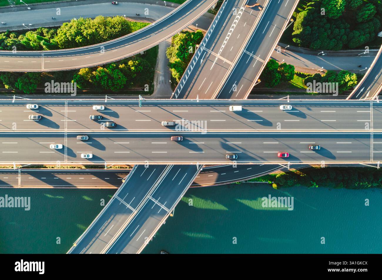 Aerial of vehicles navigate a complex highway system, showcasing ...