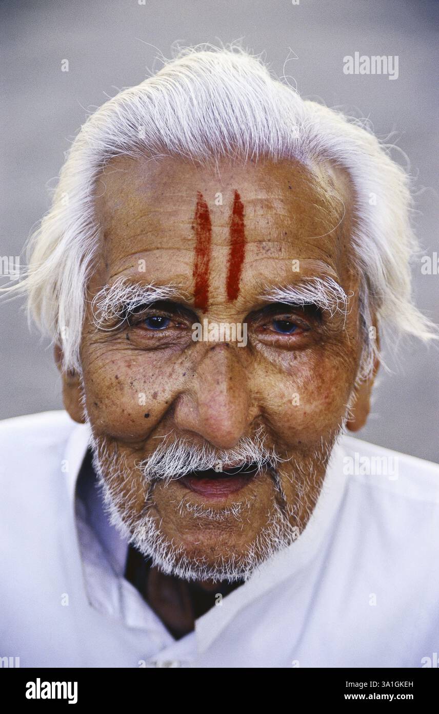 Portrait of old beard man red tilak on forehead Stock Photo - Alamy