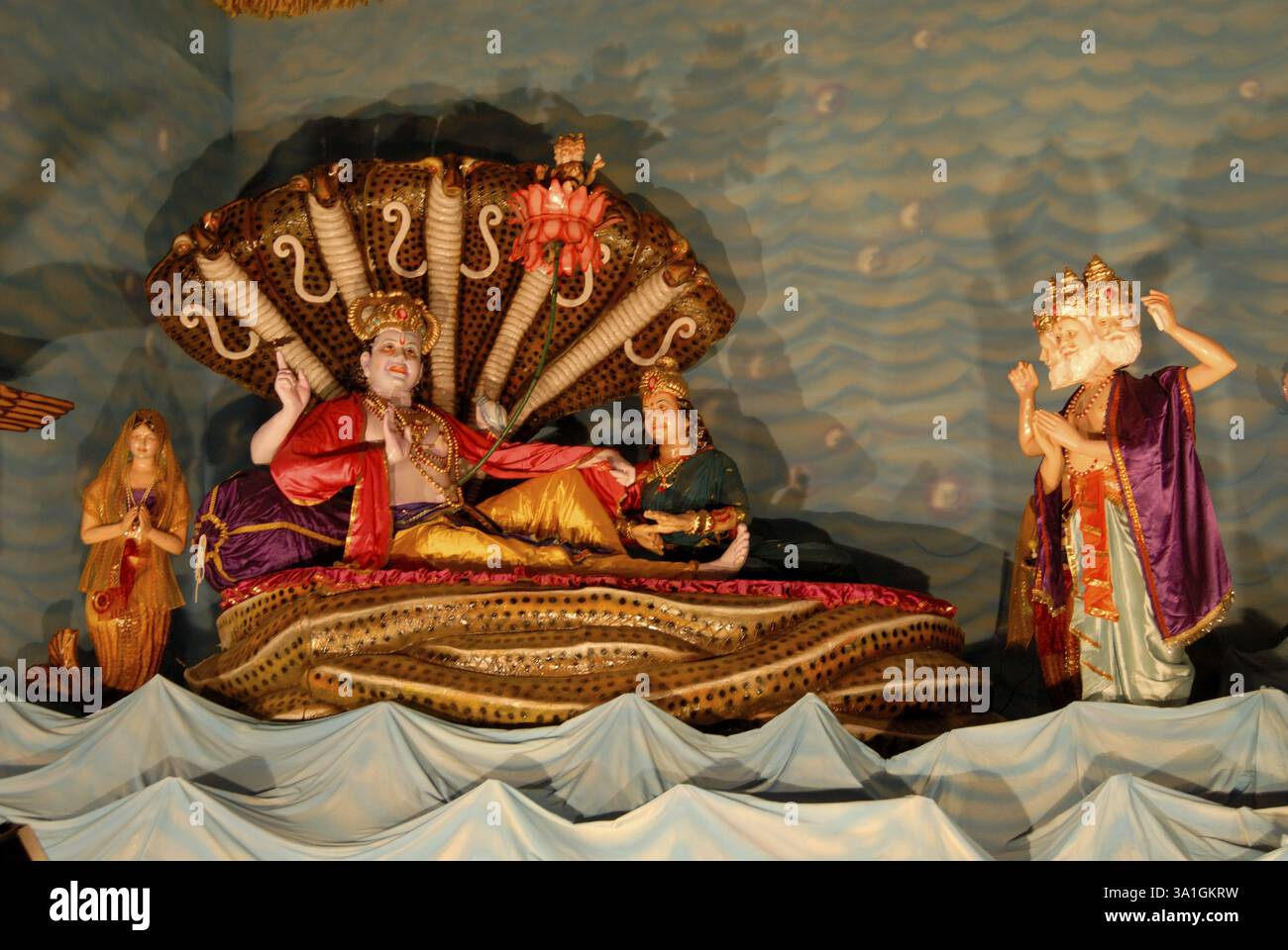 Lord Vishnu resting on serpent Sheshnaga with Laxmi and lord Bramha ...