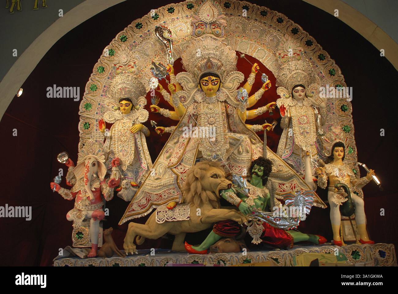 Durga clay model killing demon mahishasura with statues of kartikeya ...