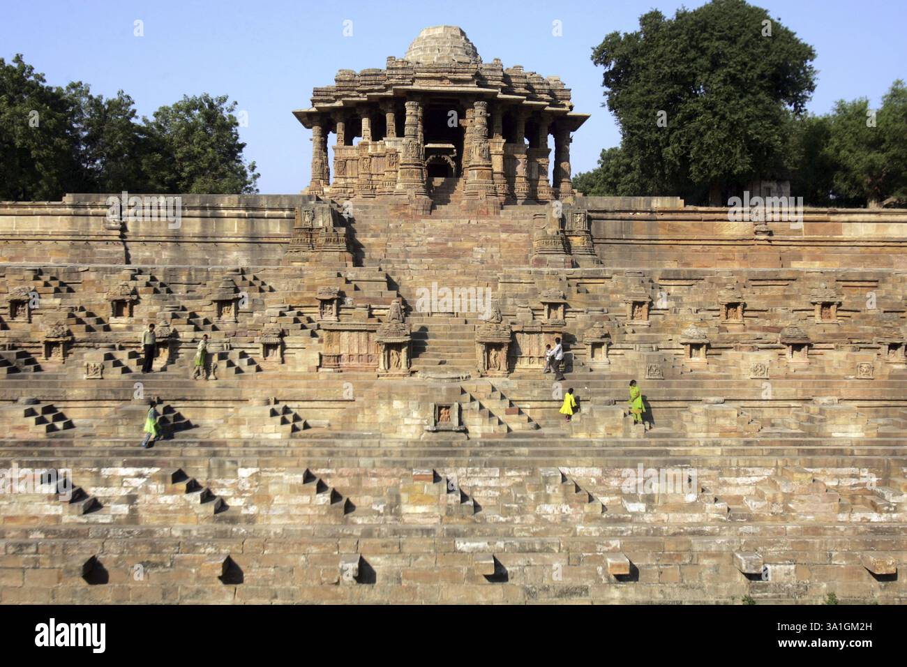 Tourists enjoying walking at Surya Kund in the complex of the Modhera ...
