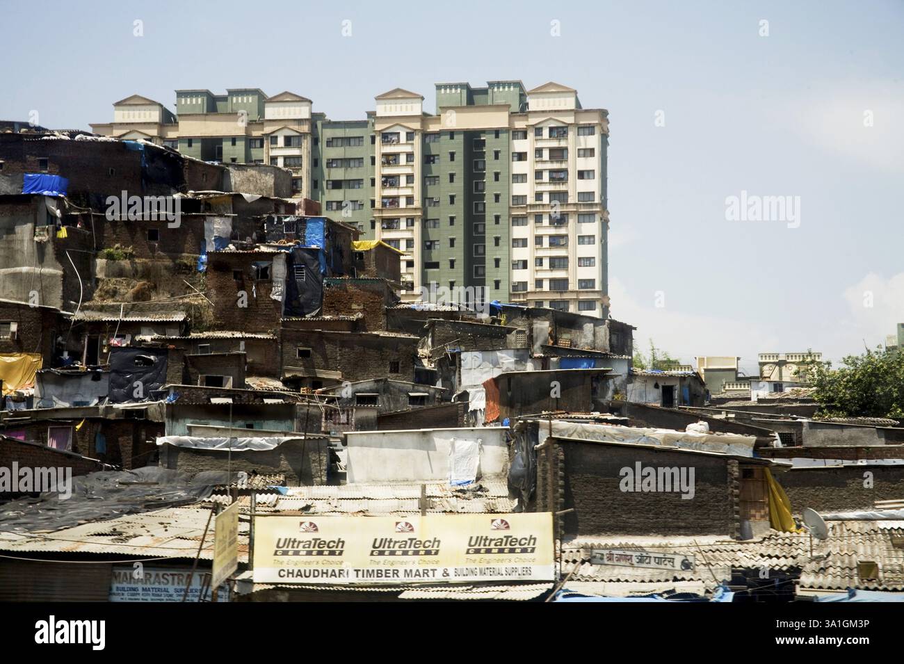 Rich and poor combination, slum and residential building at Kandivali ...