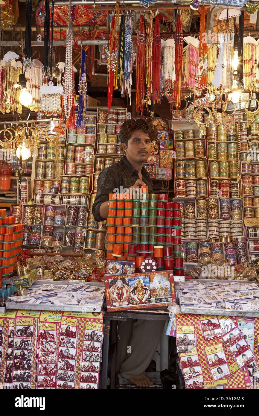 A vendor displays various offering Indian to God outside a temple ...