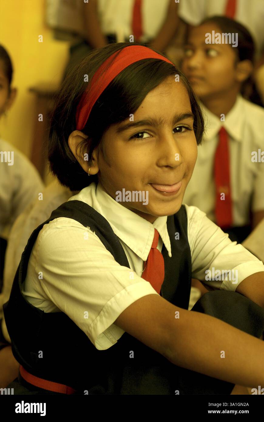 Girl smiling in the music room of Nanhi Dunya school, Dehradun ...