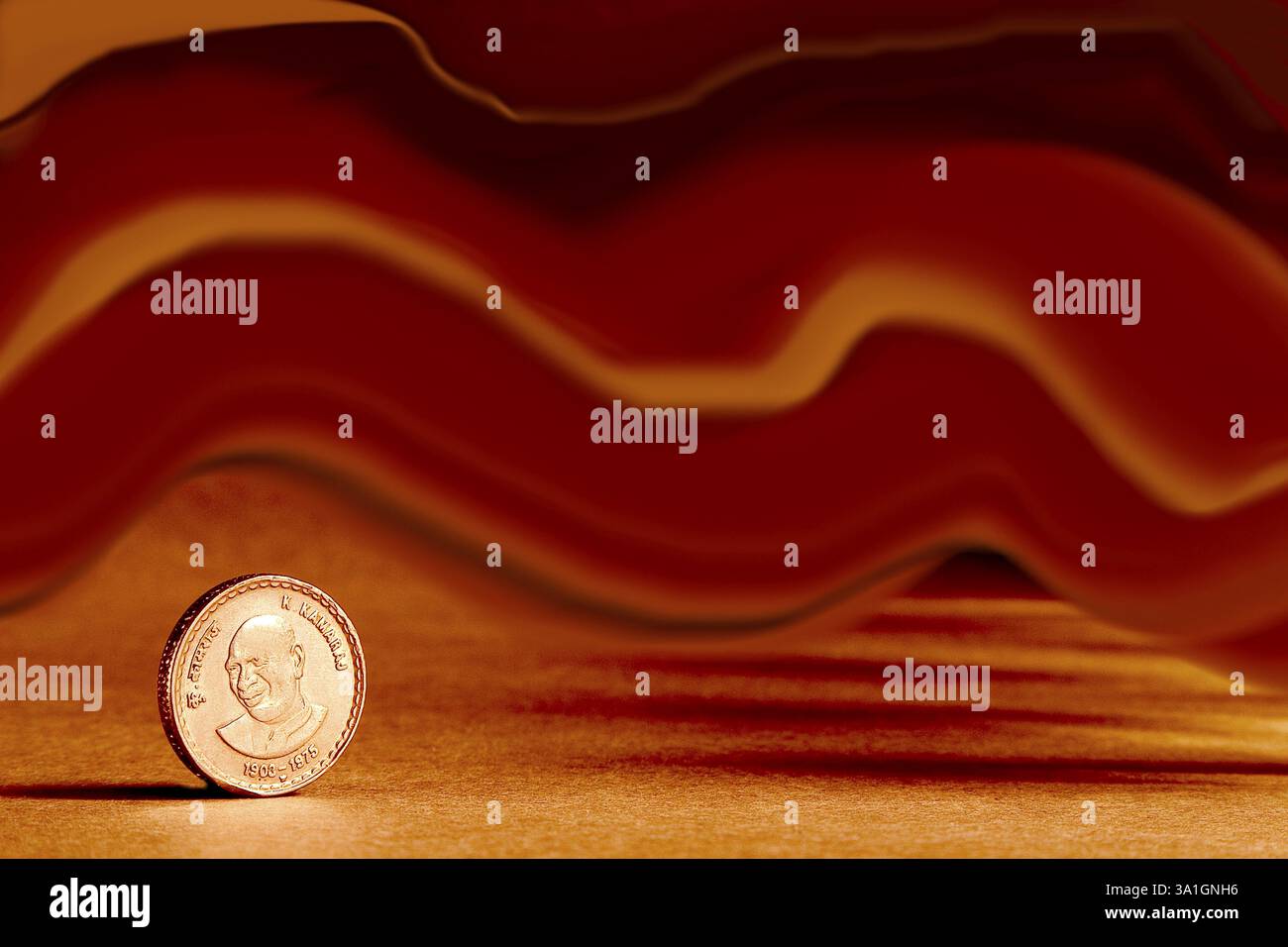 One single Indian currency five rupees coin and artistic background ...