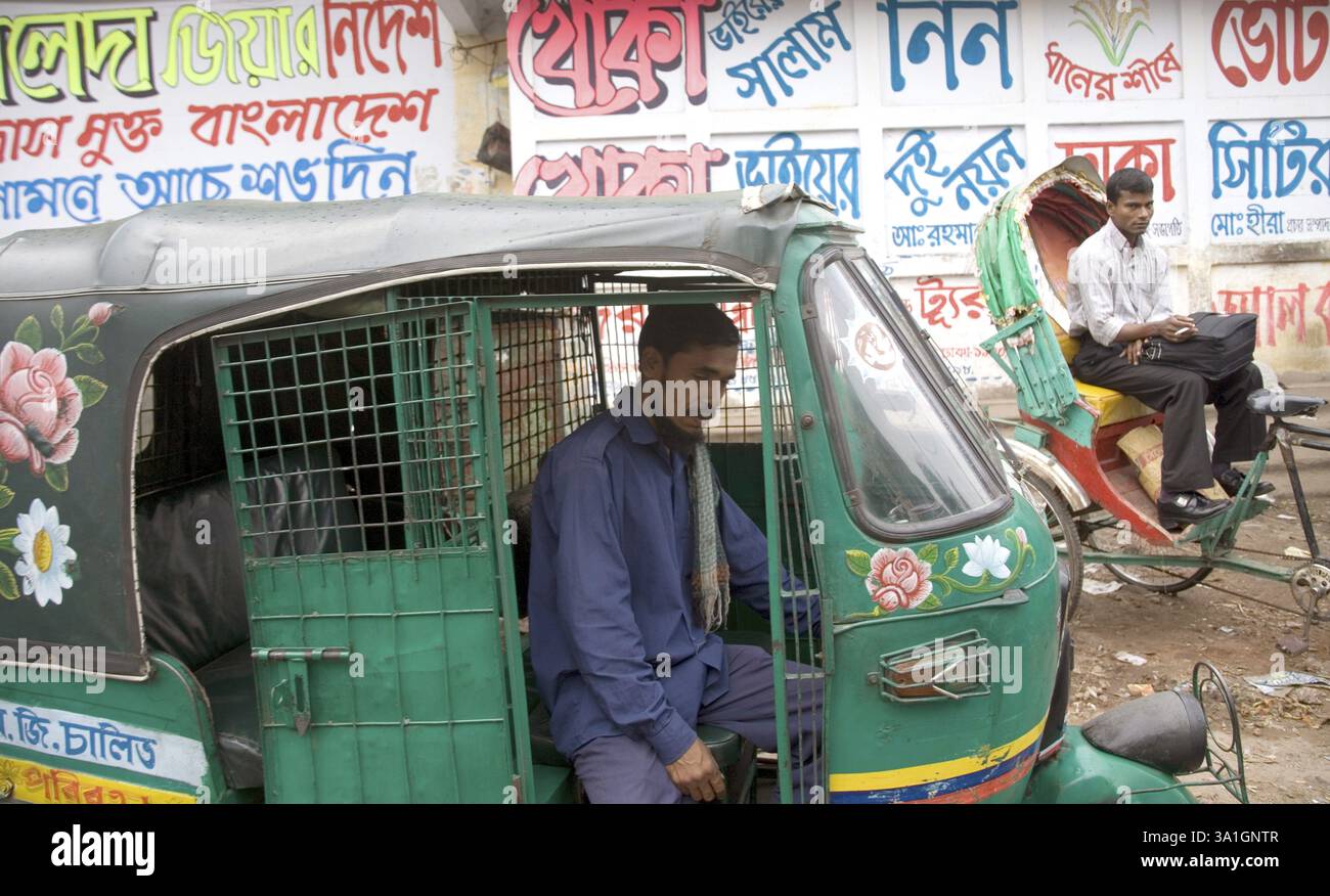 Muslim man sitting in green tempo auto rickshaw, Out side Sadarghat Boat terminal, Dhaka ...