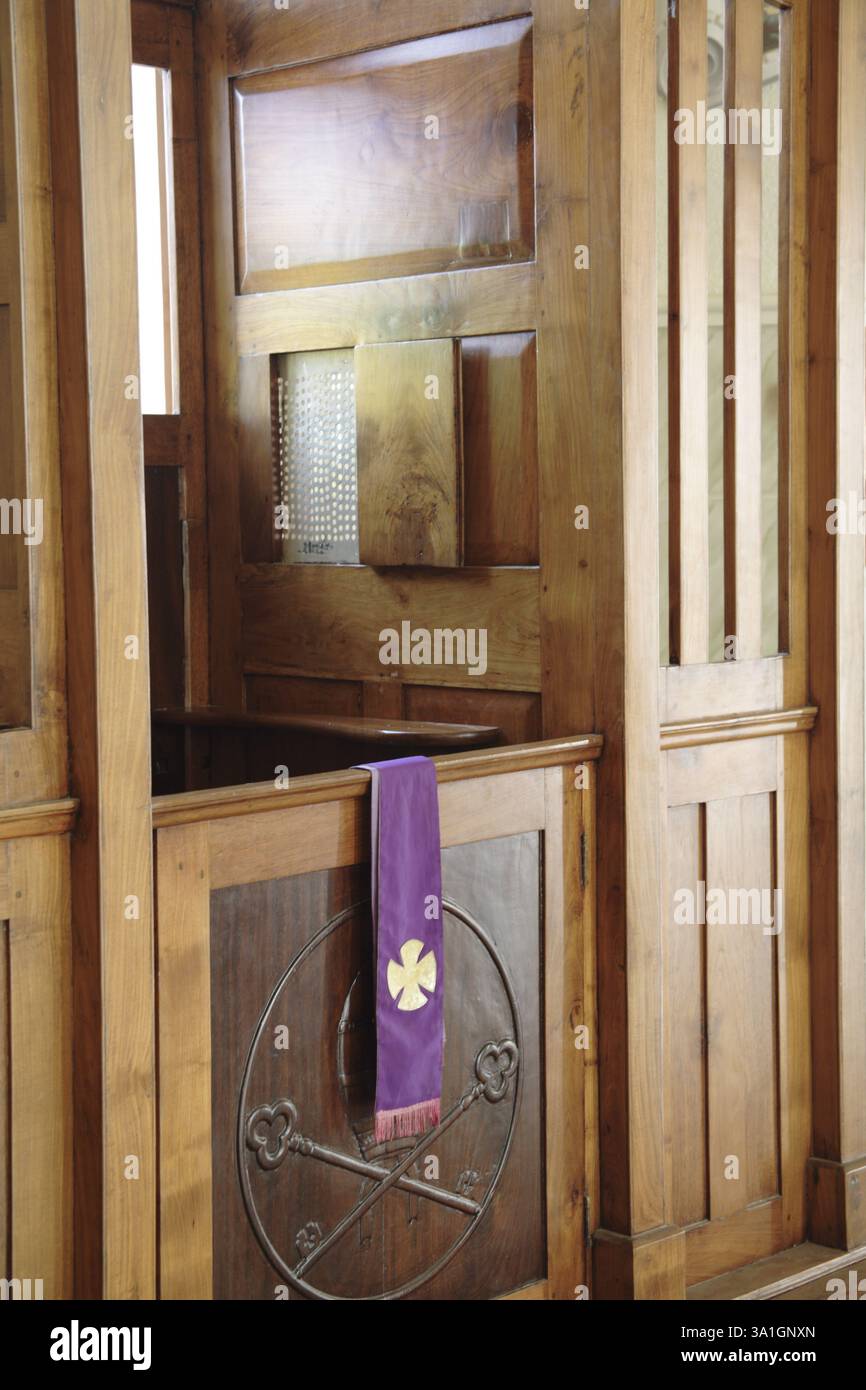 Confession box and purple stole cloth priest keeps on his chest in ...