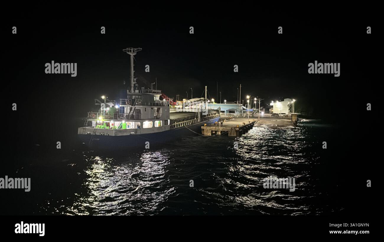 Night Ferry Docked at a Pier with Illuminated Port Facilities Stock ...