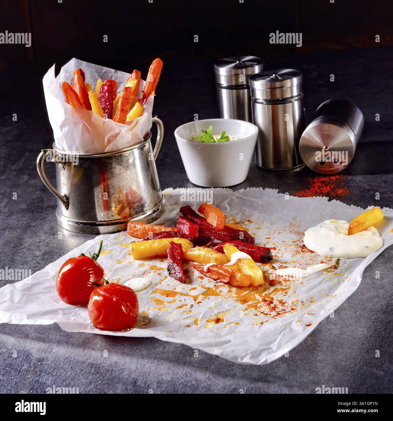 Vegetable French fries with herb quark and tomatoes Stock Photo - Alamy