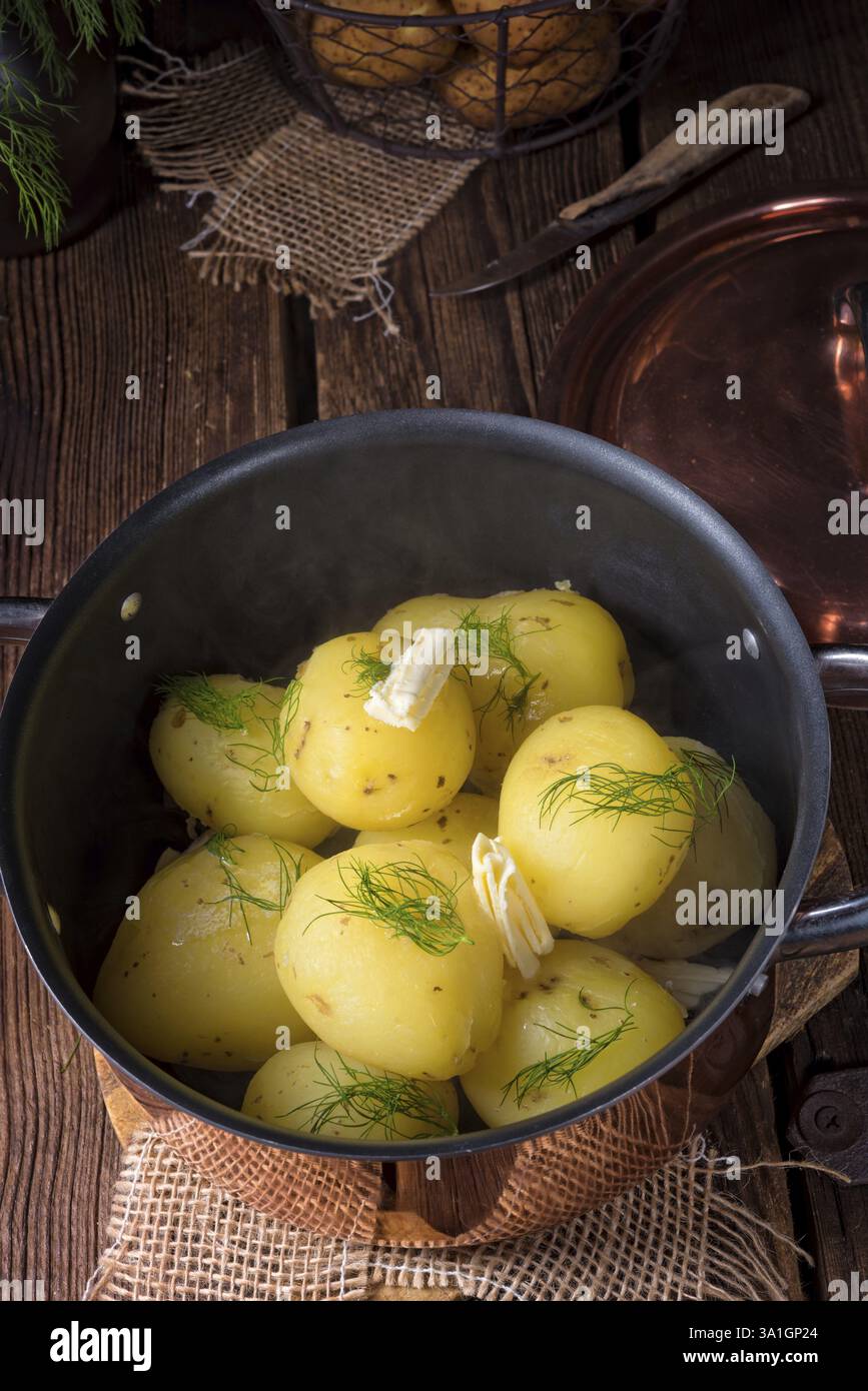Fresh boiled young potatoes with butter Stock Photo - Alamy