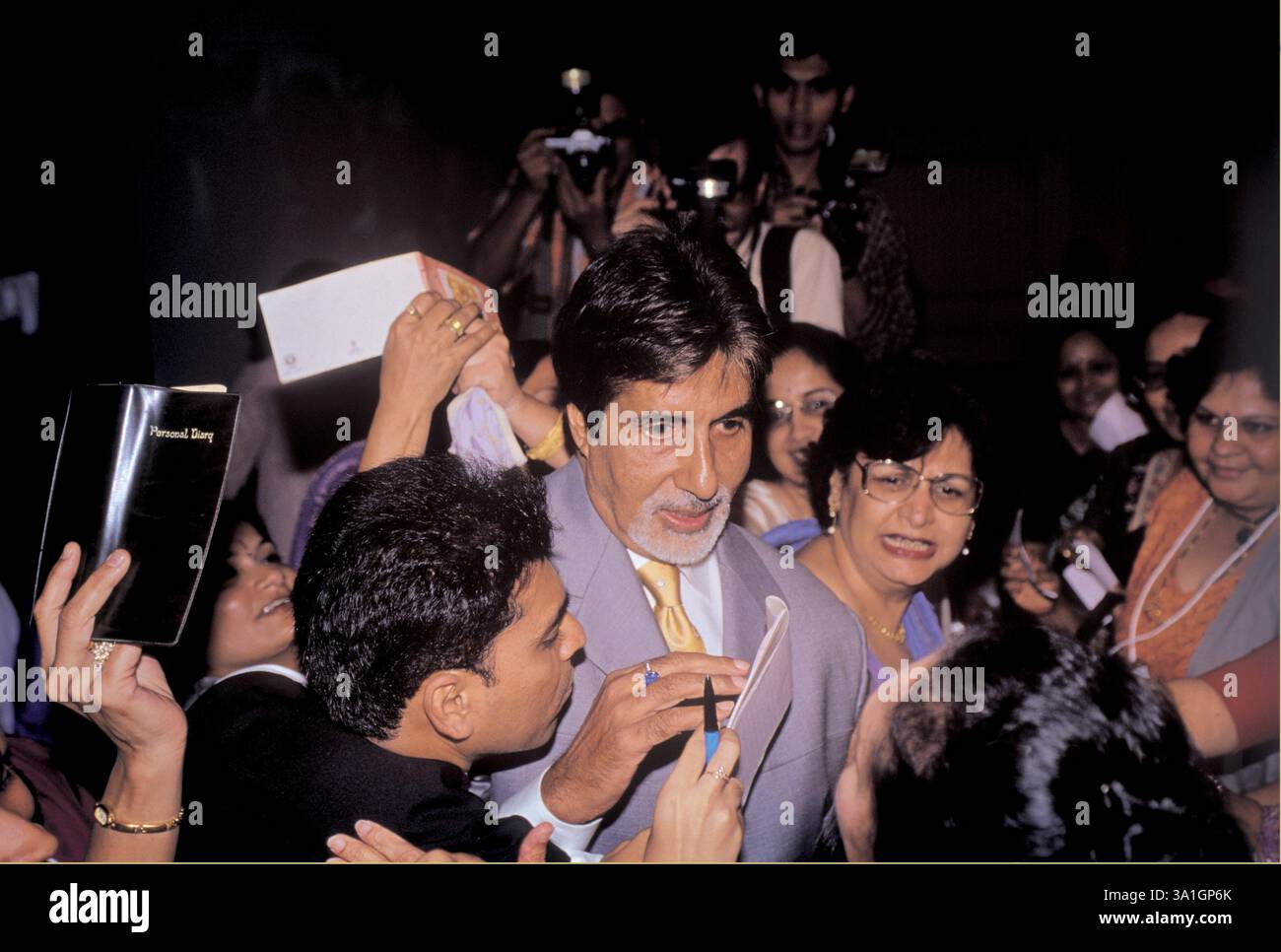South Asian Indian Bollywood actor Amitabh Bachchan surrounded by his ...