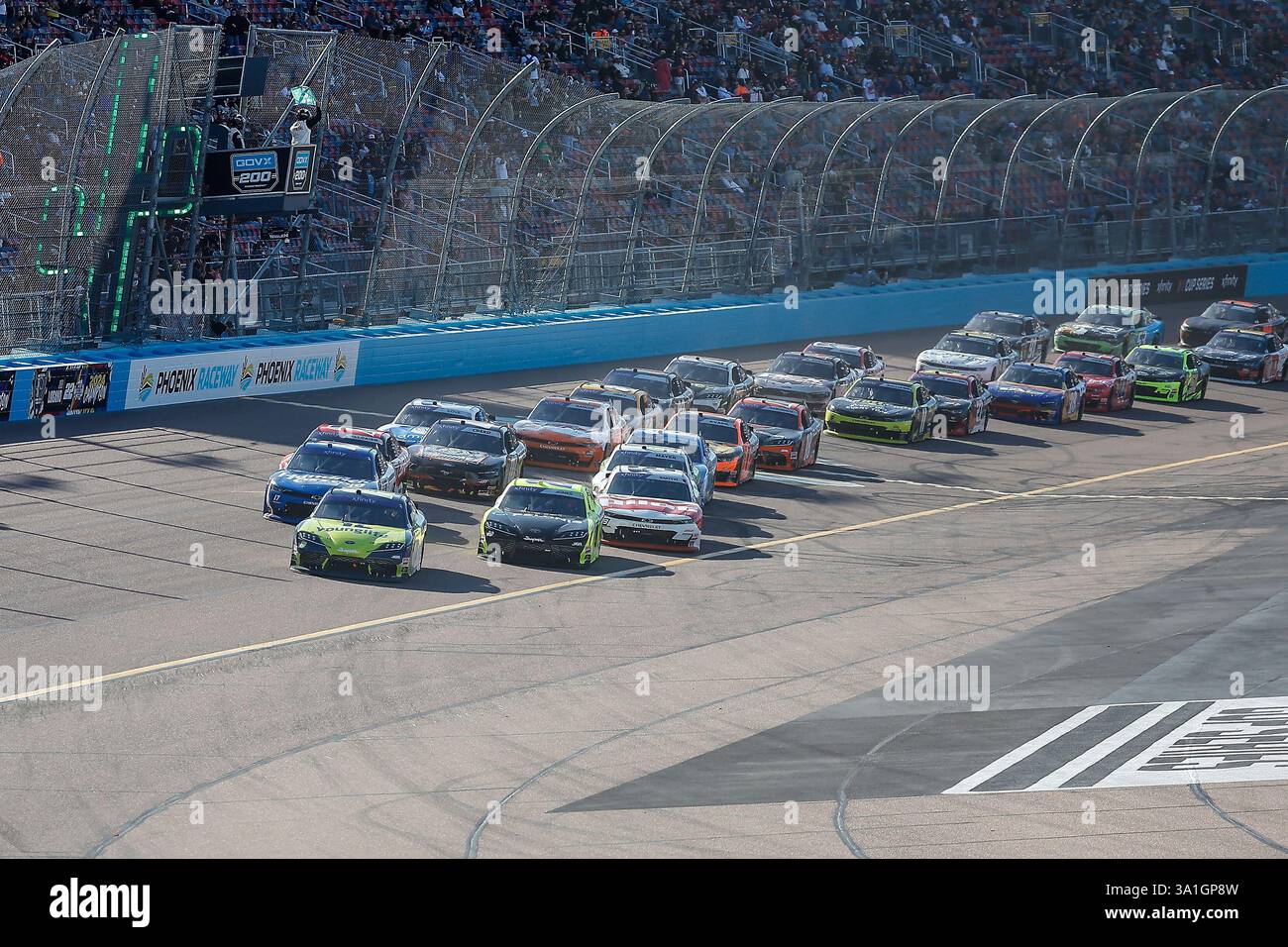 AVONDALE, AZ - MARCH 08: Xfinity cars race during a restart during the ...