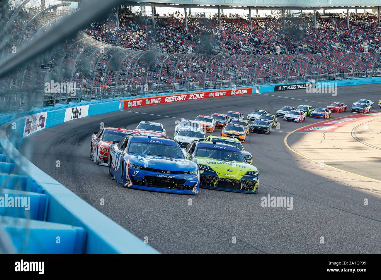 AVONDALE, AZ - MARCH 08: Xfinity cars race during a restart during the ...
